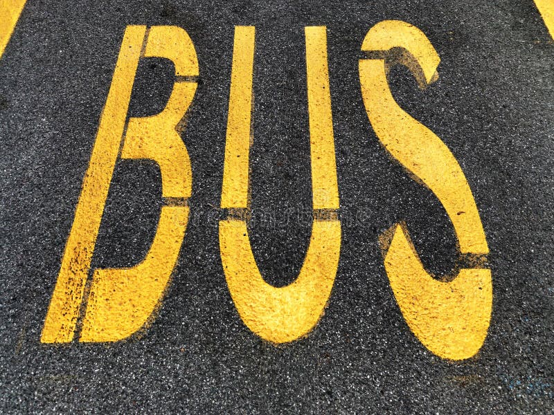 Bus Writing on Black Asphalt Stock Photo - Image of asphalt, road ...
