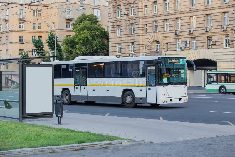 Buses Move on City Street stock photo. Image of street - 201304272