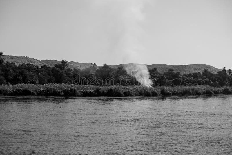 Bush Fire in Africa by the Nile Stock Photo - Image of landscape, lake ...