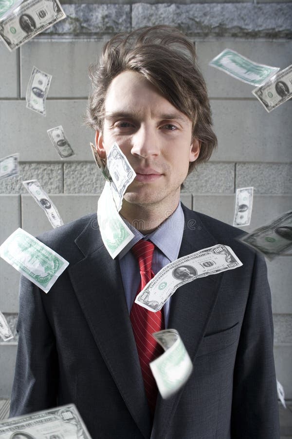 Busines Man Surrounded by Falling Money Outdoors Portrait Stock Image ...