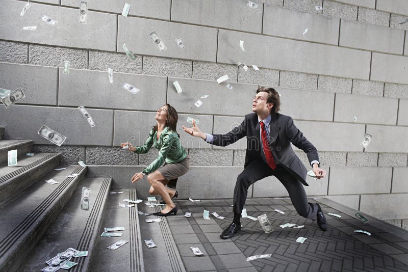 Busines Man and Woman Collecting Falling Money on Steps Stock Photo ...