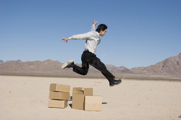 Businesman Jumping Over Boxes Stock Image - Image of businessman ...
