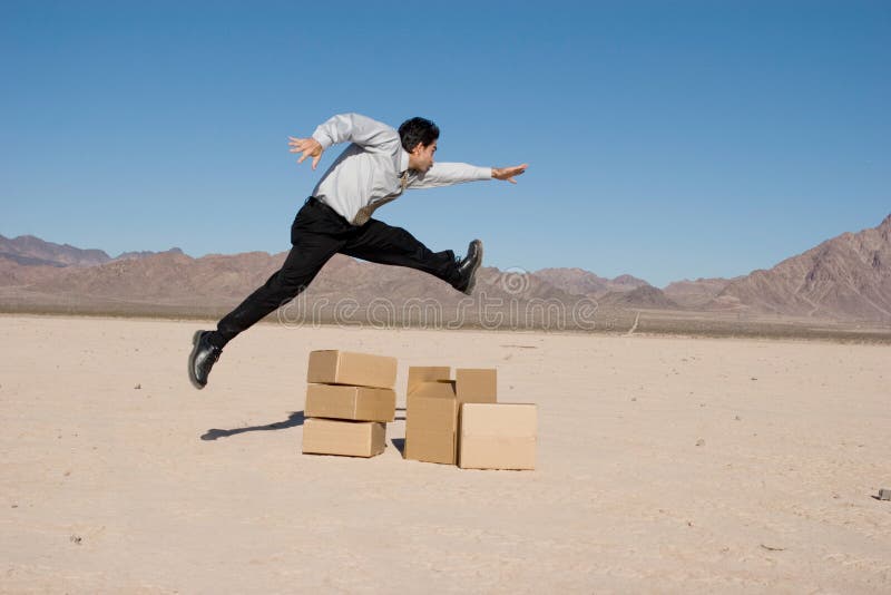 Businesman Jumping Over Boxes Stock Image - Image of manager ...