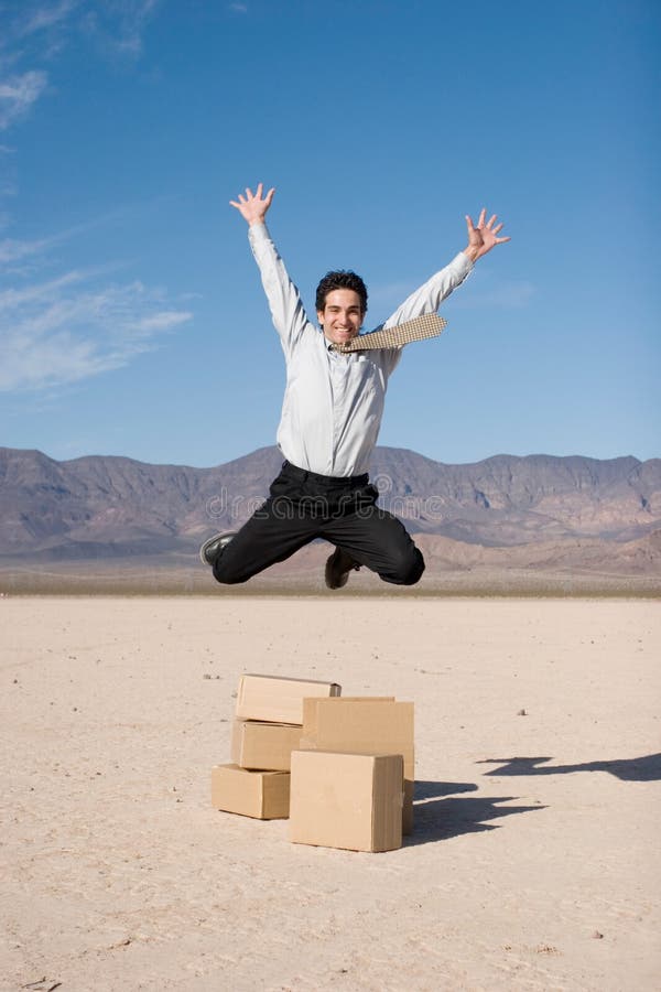 Businesman Jumping Over Boxes Stock Image - Image of shipment, decision ...