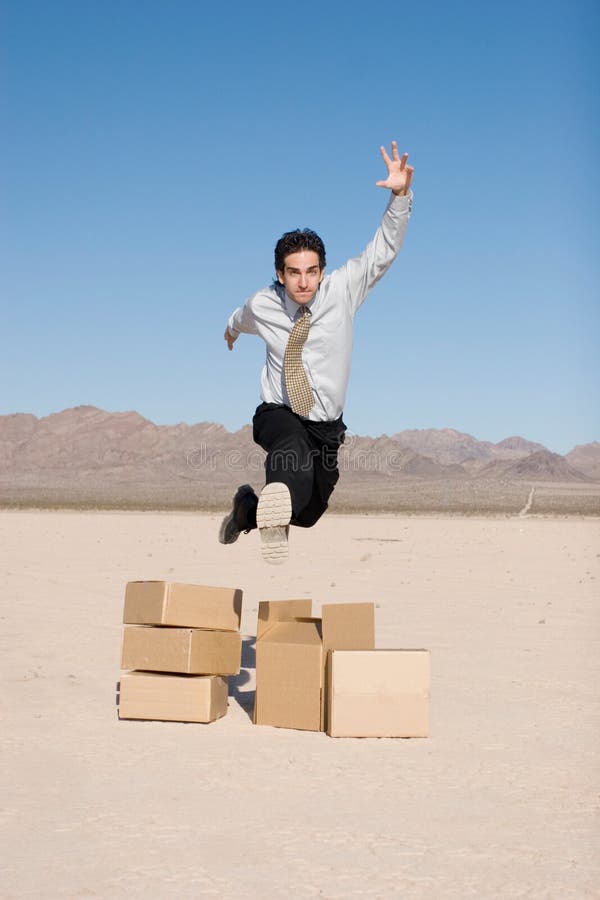 Businesman Jumping Over Boxes Stock Image - Image of important ...