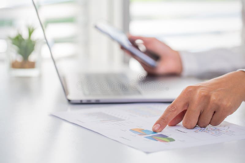 Businesman sitting in front of a laptop in the office.Data analysis ...
