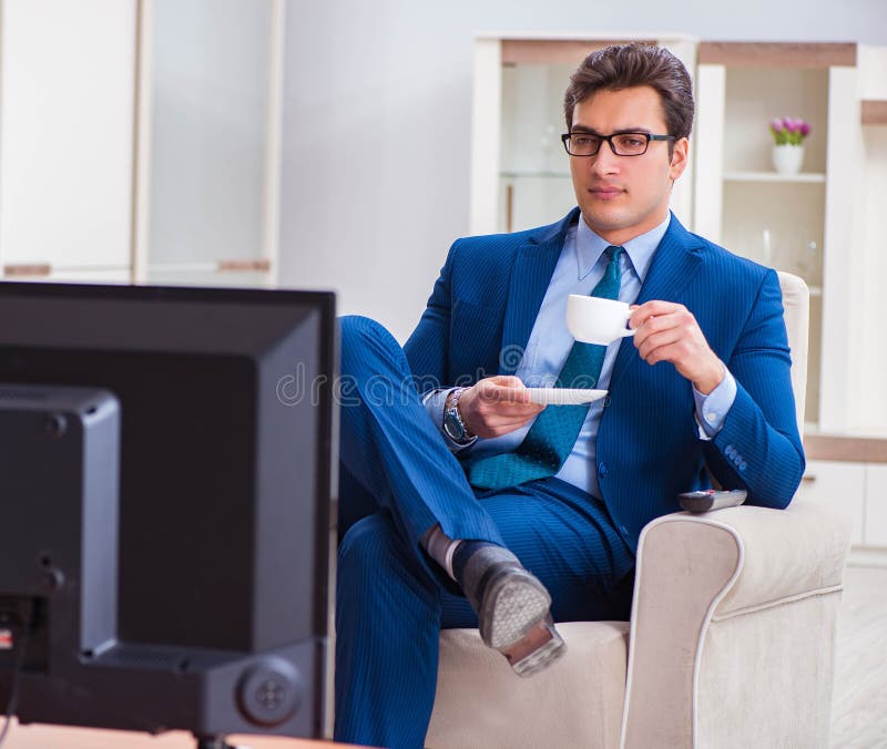 Businesman Watching Tv in Office Stock Image - Image of relaxation ...