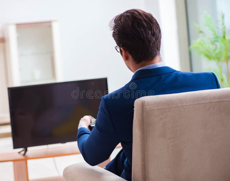 Businesman Watching Tv in Office Stock Image - Image of cinema, control ...