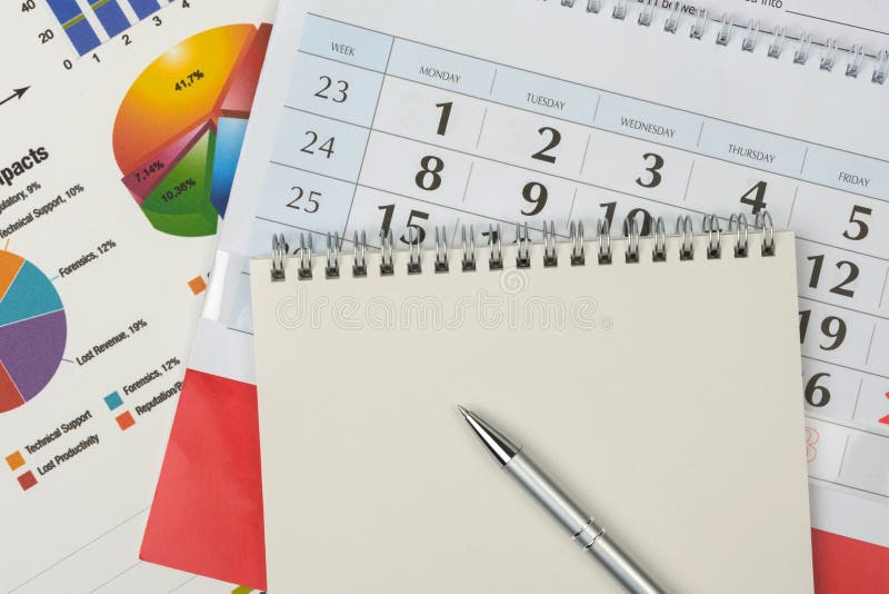 Business Accessory, Graph Charts, Calendar, Notebook and Pen on the ...