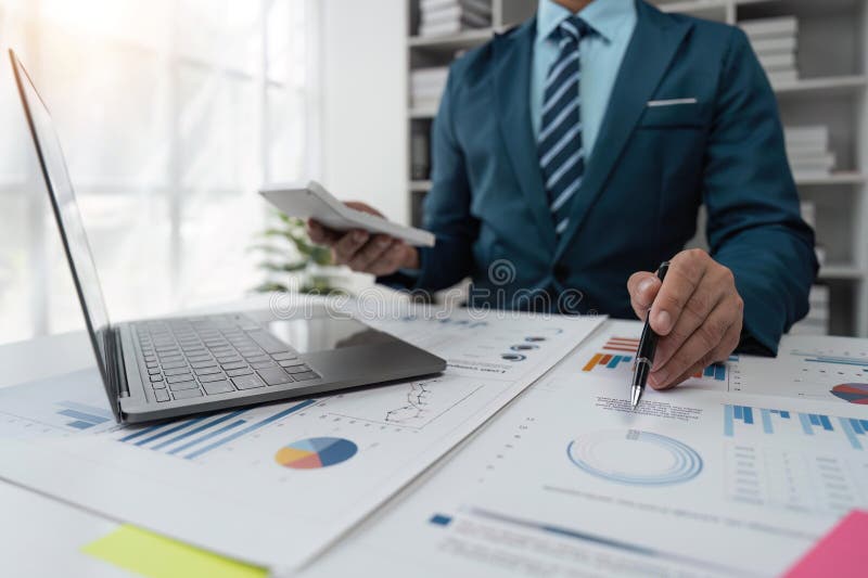 Business Accounting Concept, Business Man Using Calculator with ... Business Accounting Concept, Business Man Using Calculator with ...