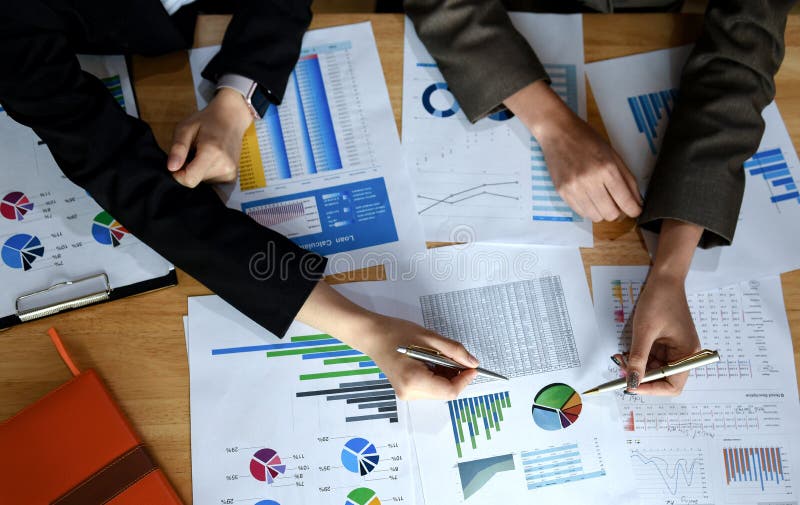 Business Adviser Analyzing Graphs Data in the Work of the Office Stock ...