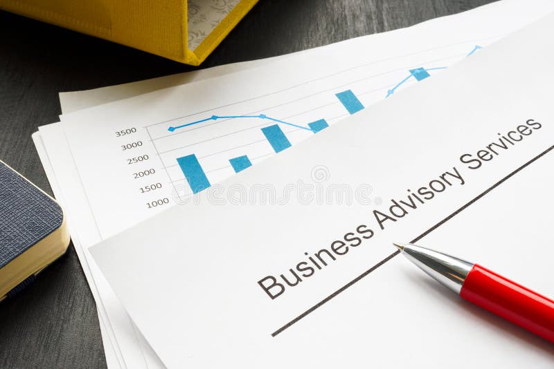 Business Advisory Services Concept. a Stack of Financial Charts and a ...