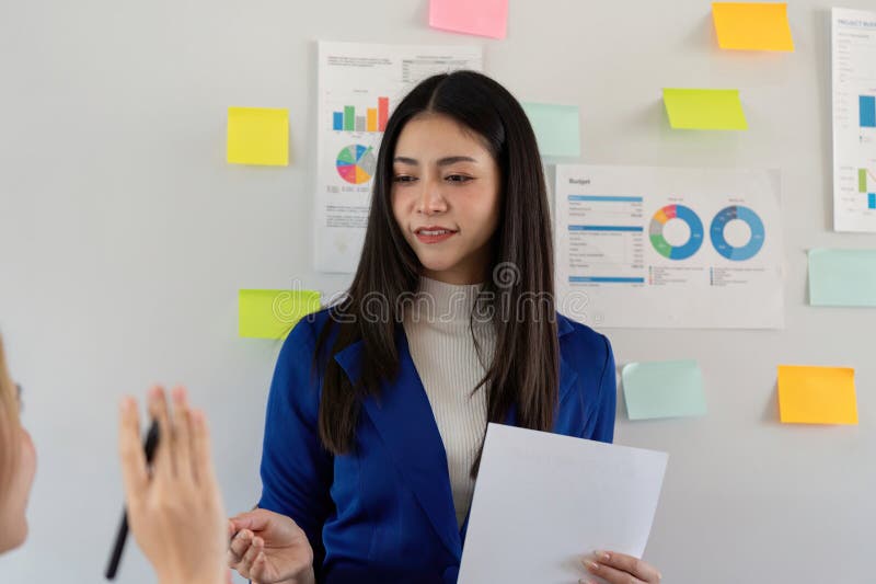 Business Analyst Presenting Budget Analysis and Project Planning in a ...