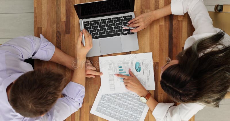 Business Analysts Work with Infographic Sheets and Laptop Stock Video ...