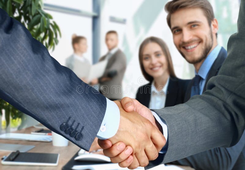 Business Associates Shaking Hands in Office. Stock Photo - Image of ...