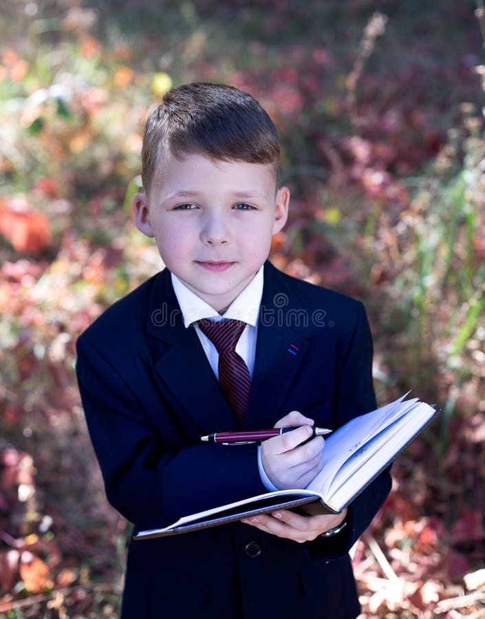 Business Baby on Nature Makes Notes in a Notebook Stock Image - Image ...