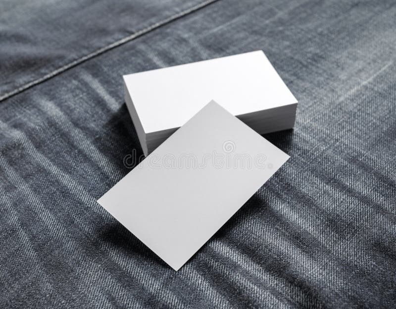 Business cards on denim stock photo. Image of office - 153694532