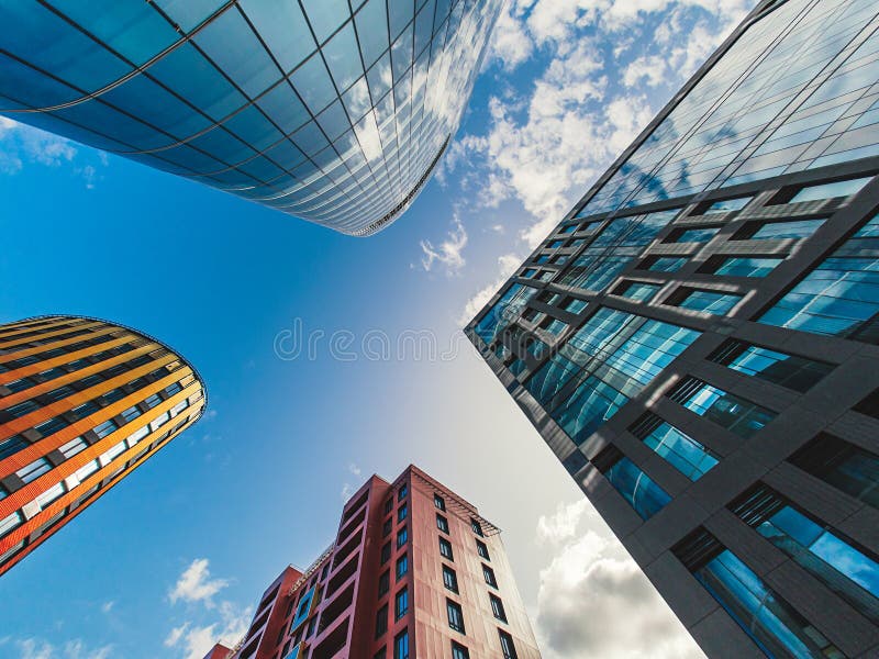 Business Center on Sky Background with Clouds. Bottom View with ...