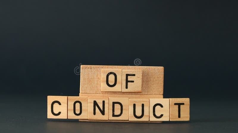 Business And Code Of Conduct Concept Businessmans Hand Sets Wooden