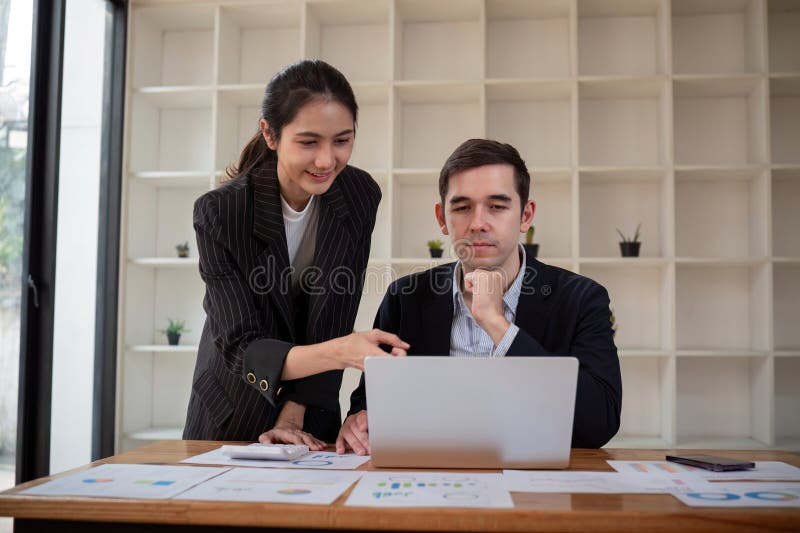 Business Colleagues Collaboration on Project in Modern Office with ...