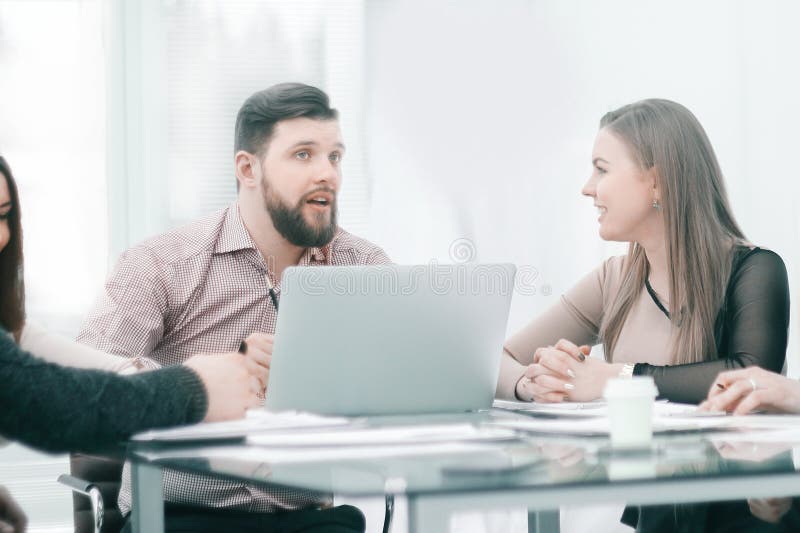 Business Colleagues Discuss Financial Data Sitting at the Desk Stock ...