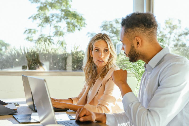 Business Colleagues Discussing about Work at the Office Stock Photo ...