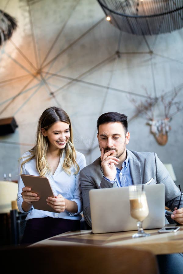 Business Colleagues Having Conversation during Coffee Break Stock Photo ...