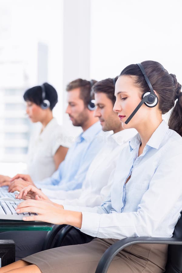Business Colleagues with Headsets in a Row Stock Image - Image of ...