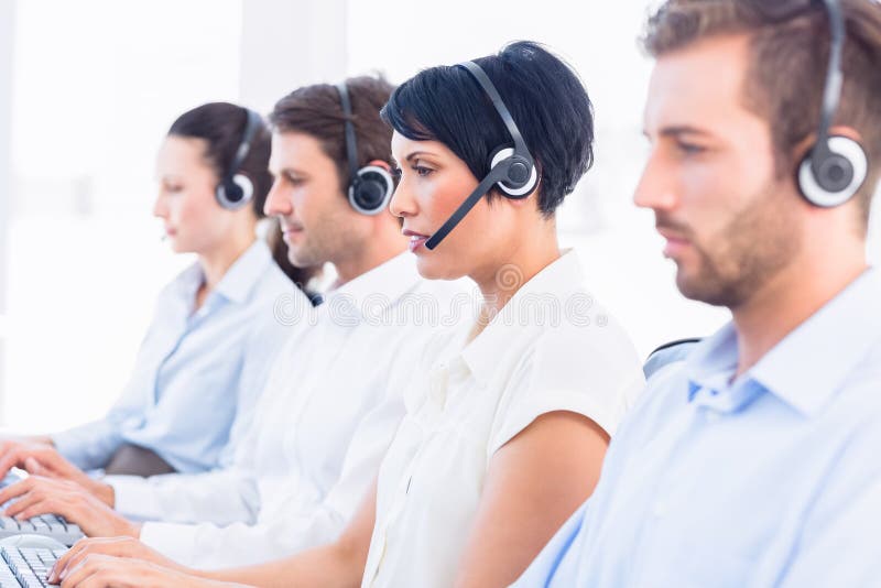 Business Colleagues with Headsets in a Row Stock Photo - Image of ...