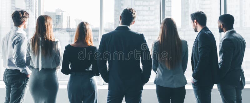 Business Colleagues Looking through Window, Back View Stock Image ...