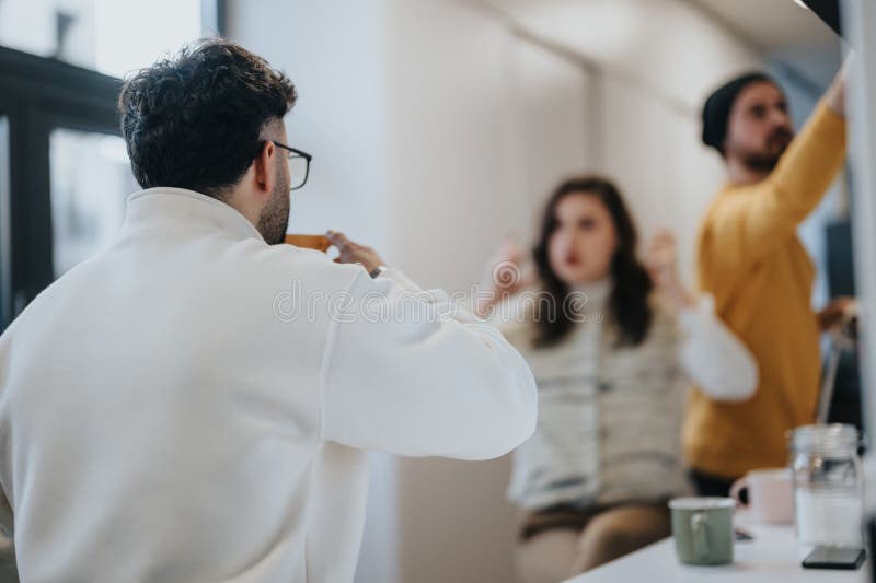 Business Colleagues in an Office Kitchen Discussing and Brainstorming ...