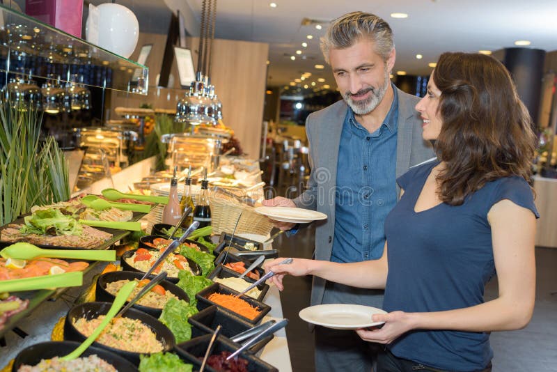 Business Colleagues Serving Themselves in Buffet Stock Image - Image of ...