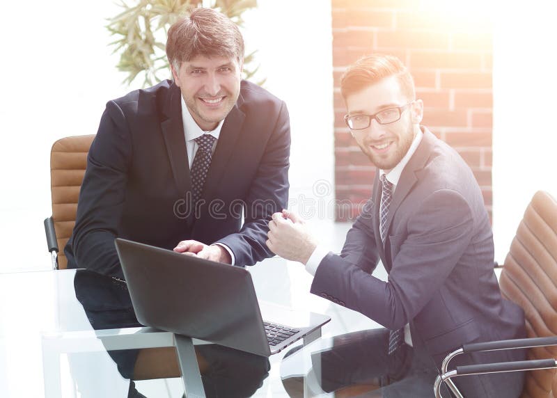 Portrait of Business Colleagues Sitting at Work Desk Stock Photo ...