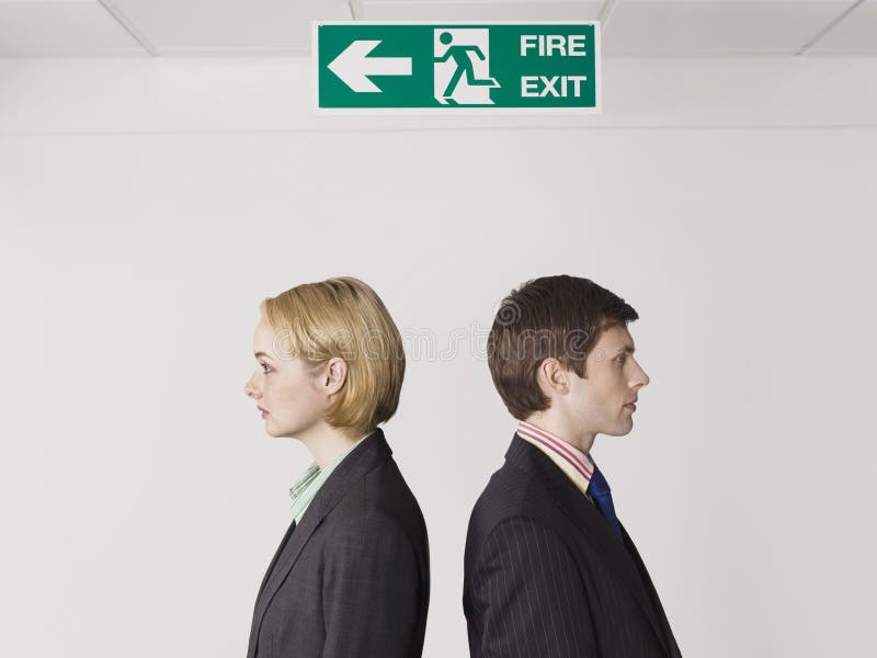 Young Businessman Standing Under Exit Sign Stock Image - Image of pride ...