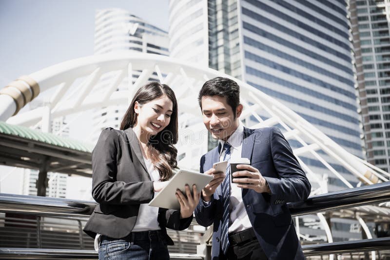 Business Colleagues Take a Look at the Work in the Tablet Stock Photo ...