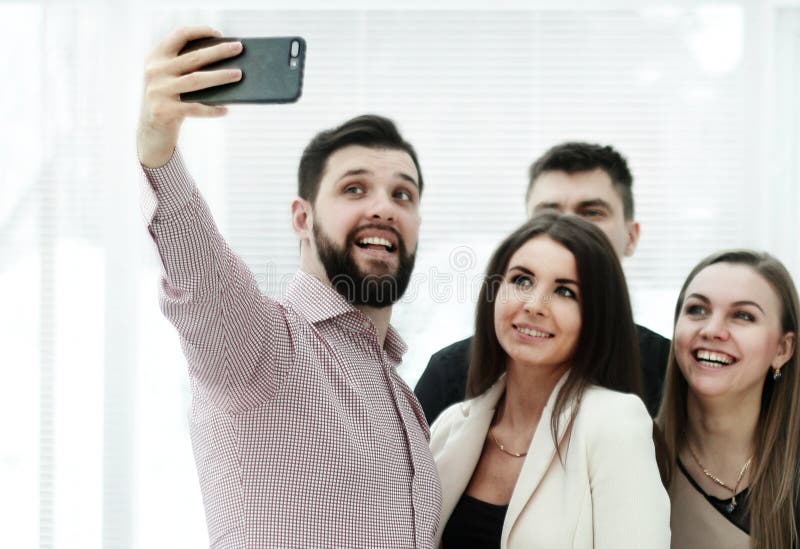 Business Colleagues Taking A Selfie In A Modern Office Stock Image