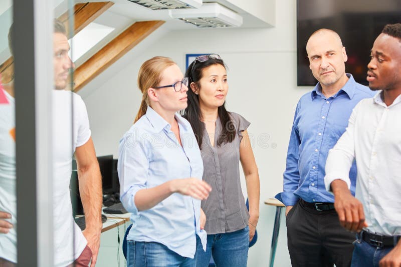 Students Discussing Assignments Stock Photo - Image of discussion ...