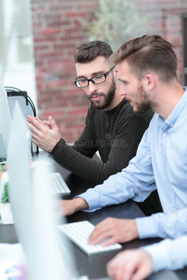 Business Colleagues Talk, Sitting at a Computer Table Stock Image ...
