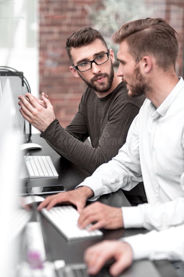 Business Colleagues Talk, Sitting at a Computer Table Stock Photo ...