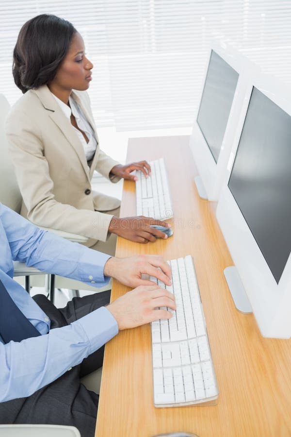 Business Colleagues Using Computers at Desk Stock Photo - Image of ...