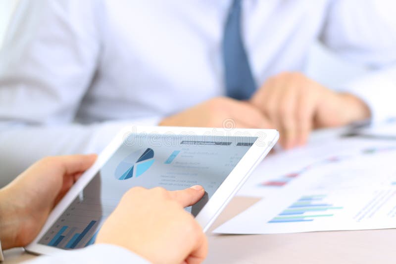 Business Man Working and Analyzing Financial Figures on a Graphs on a ...