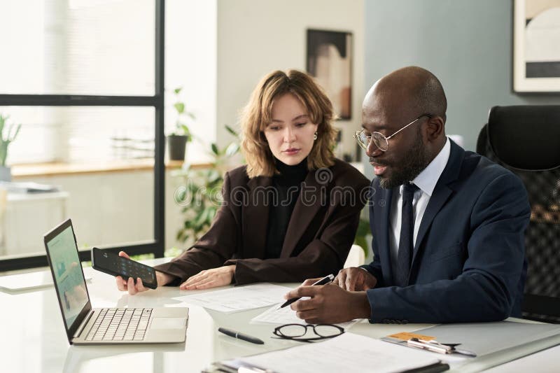 Business Colleagues Working with Financial Reports Stock Photo - Image of manager, multiethnic ...