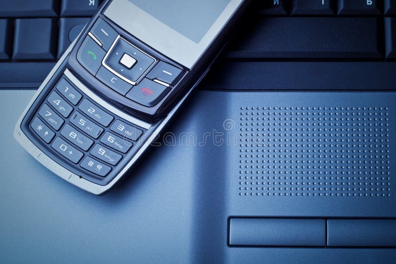 Pda Phone on Laptop Keyboard Stock Photo - Image of executive ...