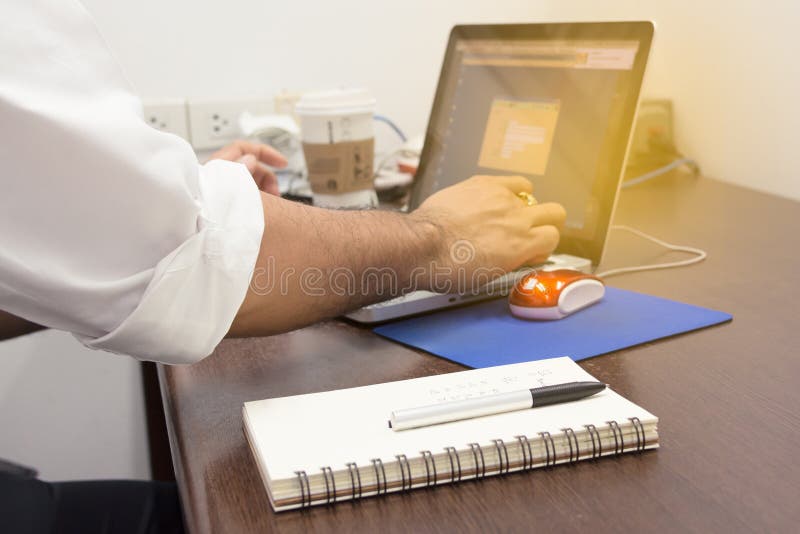 Businessman Inputting Data on His Laptop Computer Stock Photo - Image ...