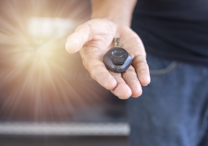 Car Key Remote on Hand. Hand Man Giving a Car Key Stock Photo - Image ...