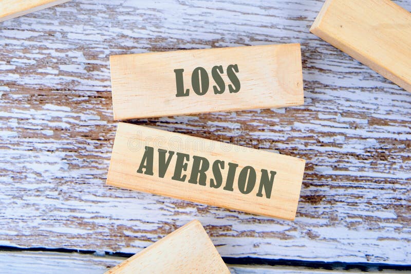 Business Concept. LOSS AVERSION Text on Wooden Blocks on Old Boards ...