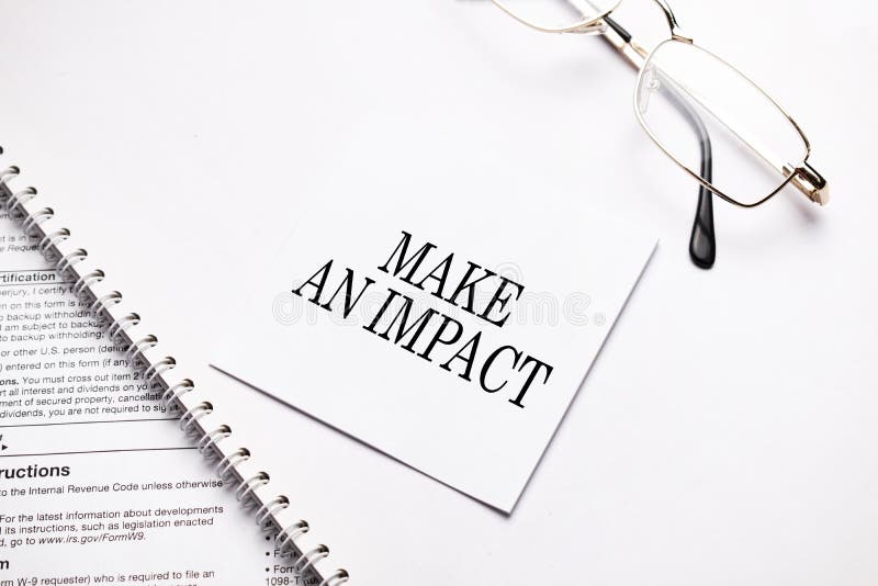 Business Concept. Notebook with Text MAKE an IMPACT Sheet of White ...