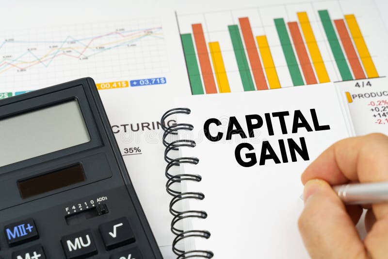 There is a Calculator on the Table, Business Charts, a Man Made a Note ...