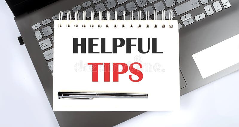 Business Concept - Top View Notebook Writing Helpful Tips on the Laptop ...