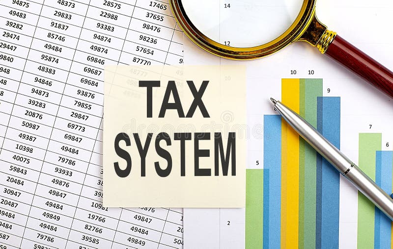 Business Concept. Top View of Stiscker with Text TAX SYSTEM on Chart ...